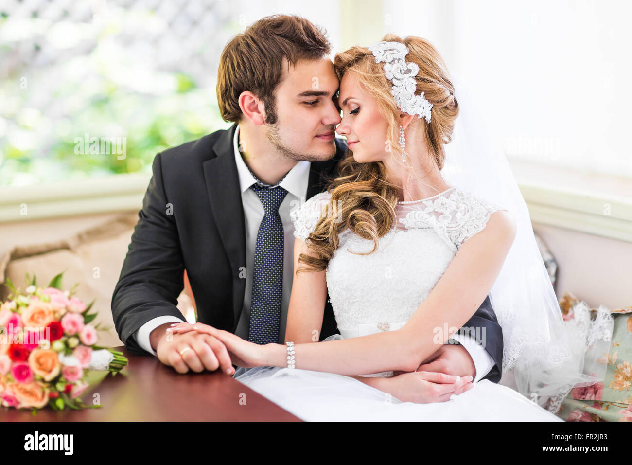 Just married couple embraced Stock Photo - Alamy