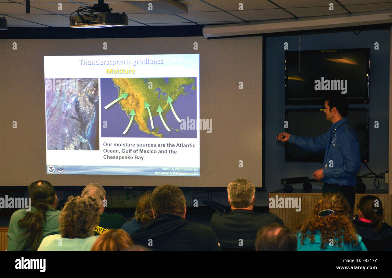 A NOAA weather expert teaching a class of professional weather spotters ...