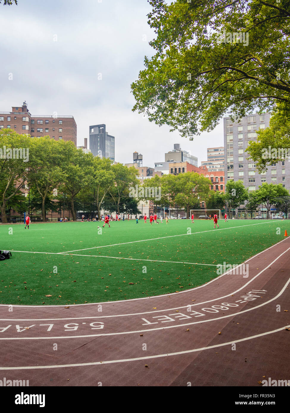 Football being played at Chelsea Ballfields, New York City, USA Stock ...