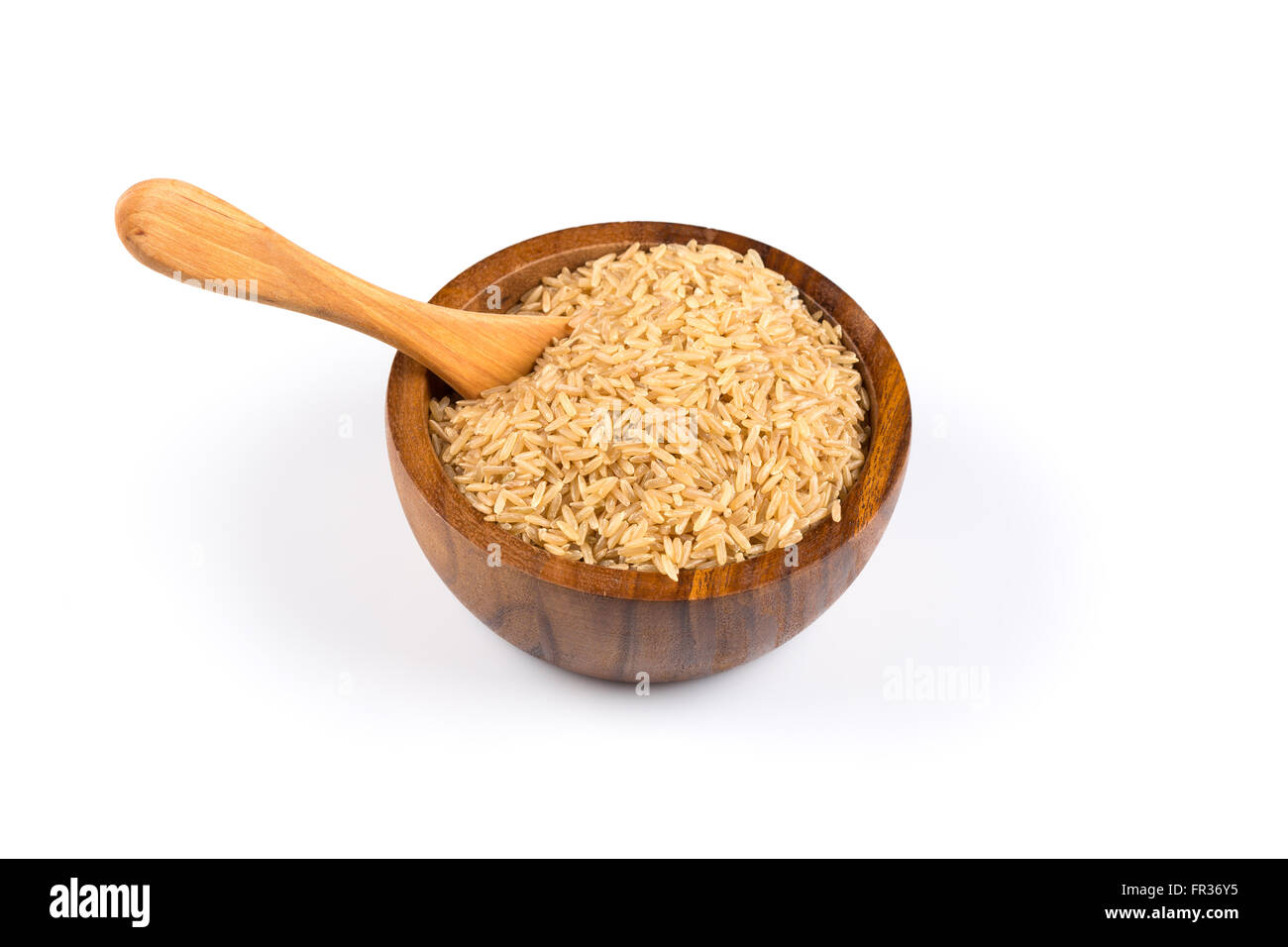 Rice in wooden bowl on white background Stock Photo - Alamy