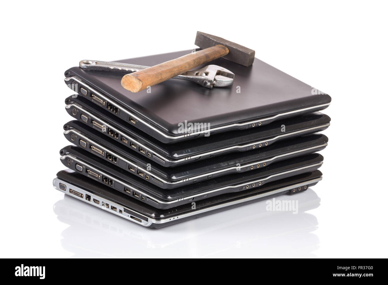 stack of old laptops awaiting repair isolated on white background Stock ...