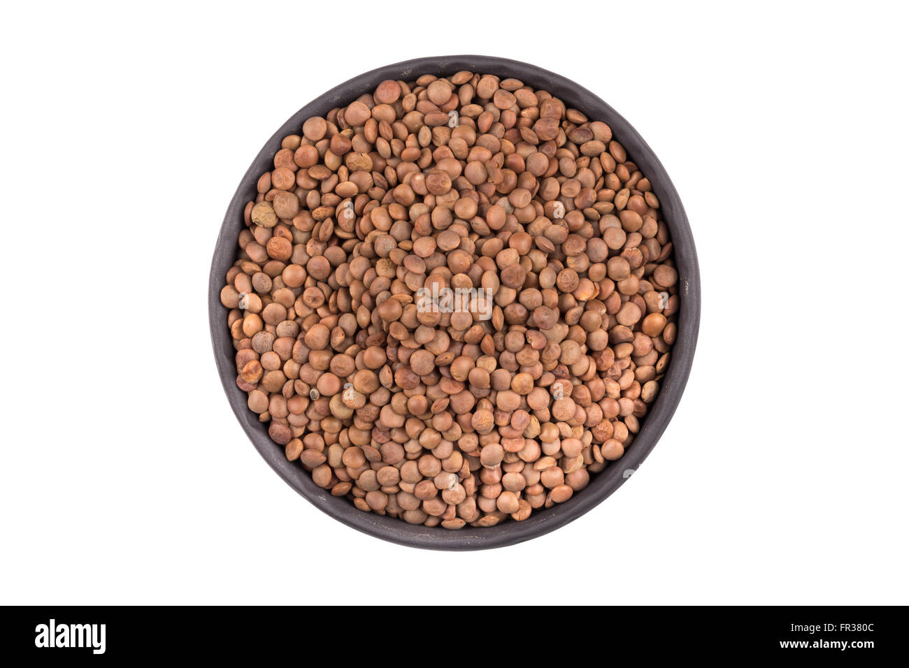Organic lentils in bowl Isolated on a white background - close up shot ...