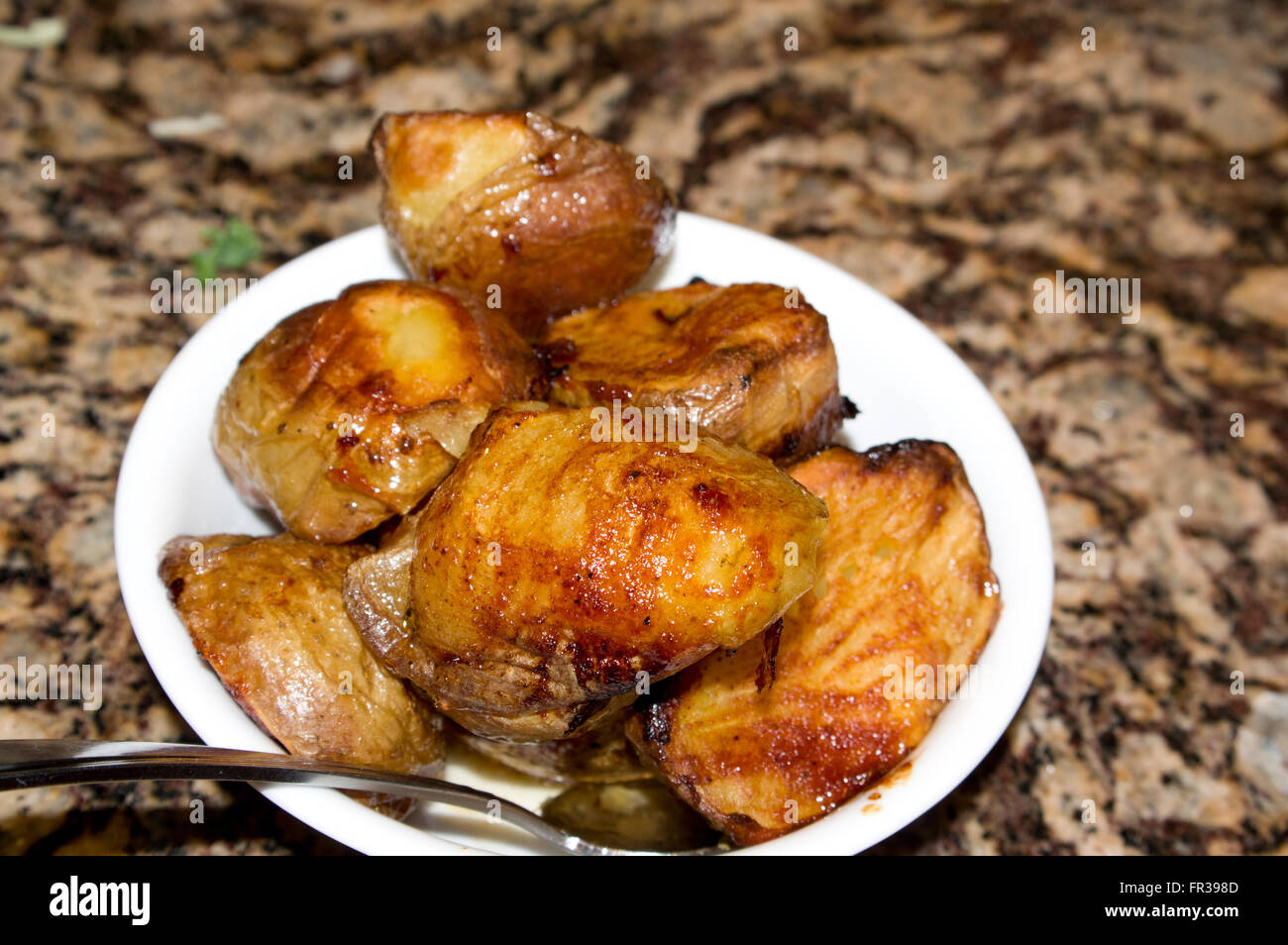 roasted potatoes, spoon,bowl Stock Photo - Alamy