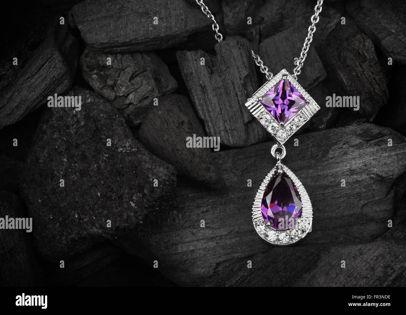 jewelry pendant witht gems on dark coal background Stock Photo - Alamy