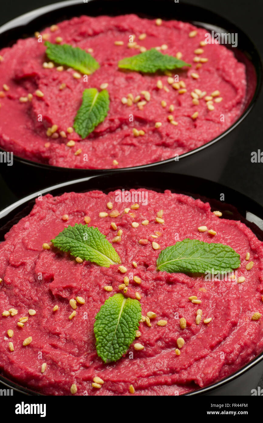 Beet hummus in black hi-res stock photography and images - Alamy