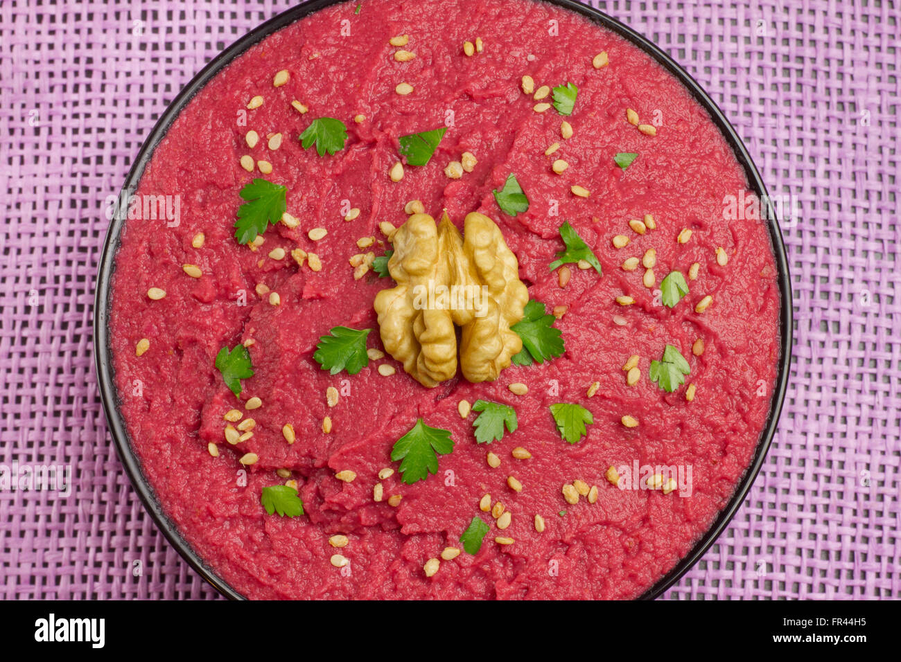 Beet hummus in black hi-res stock photography and images - Alamy