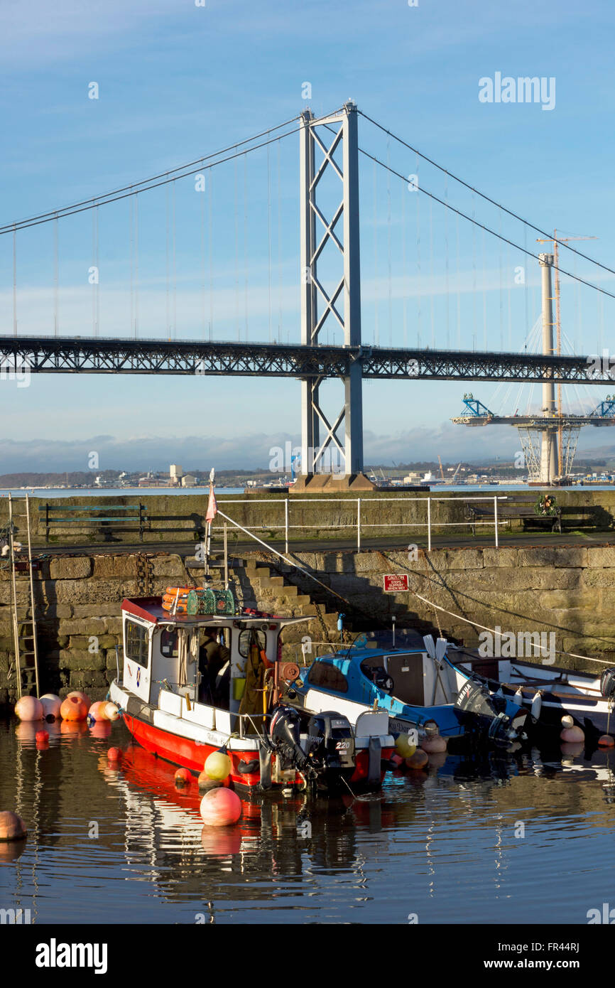 Queensferry harbour, with the Forth Road Bridge and a tower of the new ...
