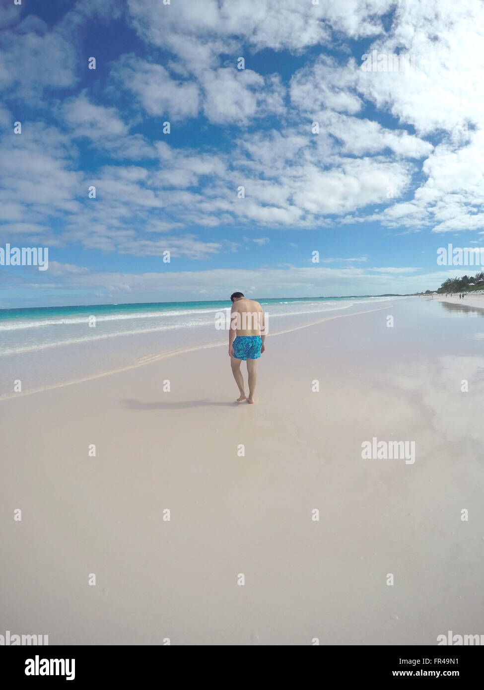 People: Man walking on beach with his head down Stock Photo - Alamy