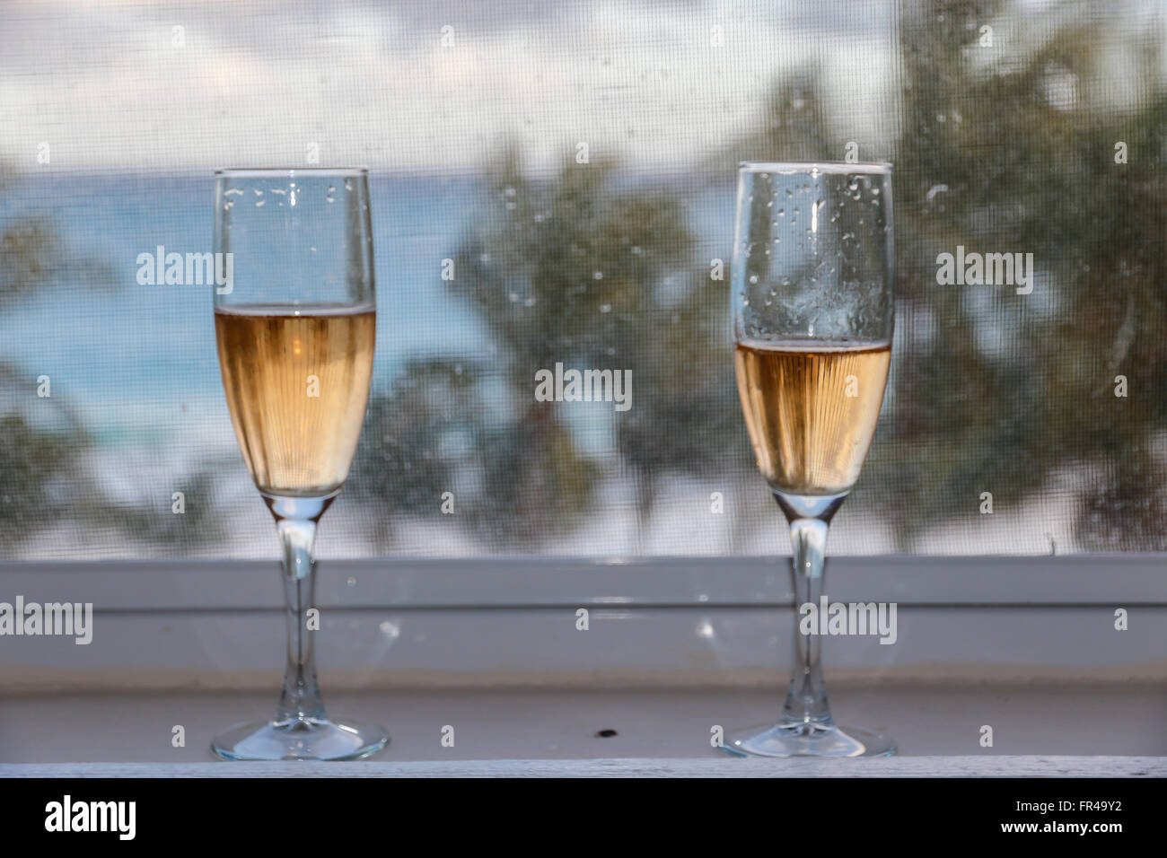 Two champagne drinks in the window Stock Photo - Alamy