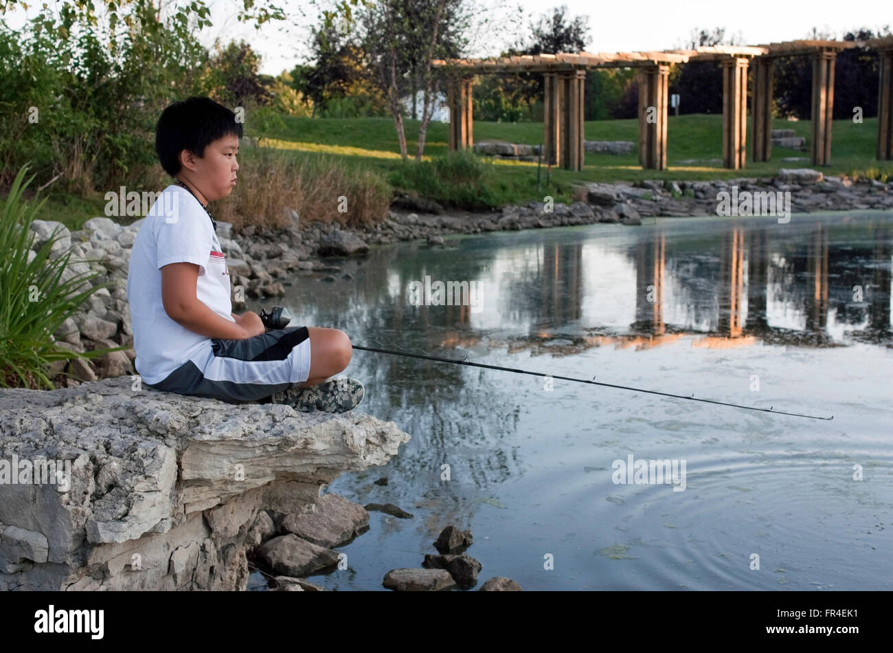 Boy child kid with fishing pole hi-res stock photography and images - Alamy