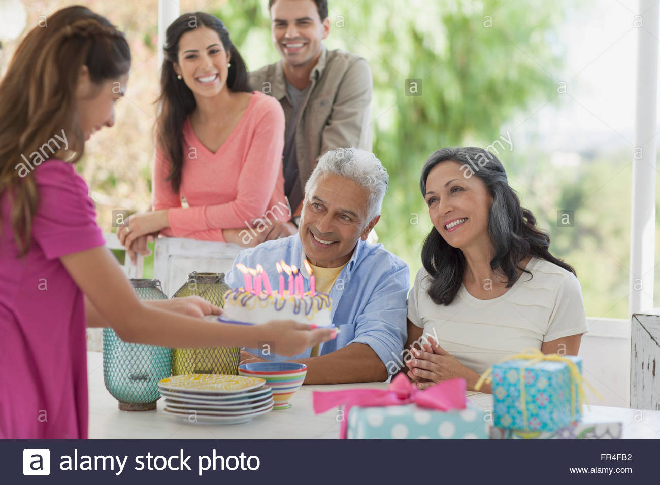 daughter presenting birthday cake to father Stock Photo - Alamy
