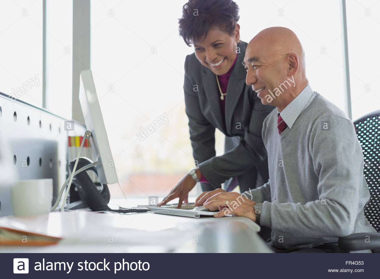 Old desktop computer african woman hi-res stock photography and images ...