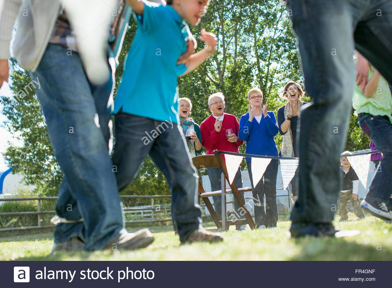 Family cheering on teams competing hi-res stock photography and images ...