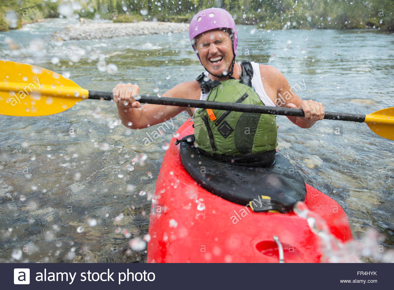 kayaker paddling through the fast flowing water Stock Photo - Alamy