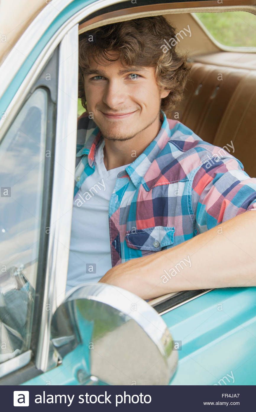 Handsome man looking out the window of the car hi-res stock photography ...