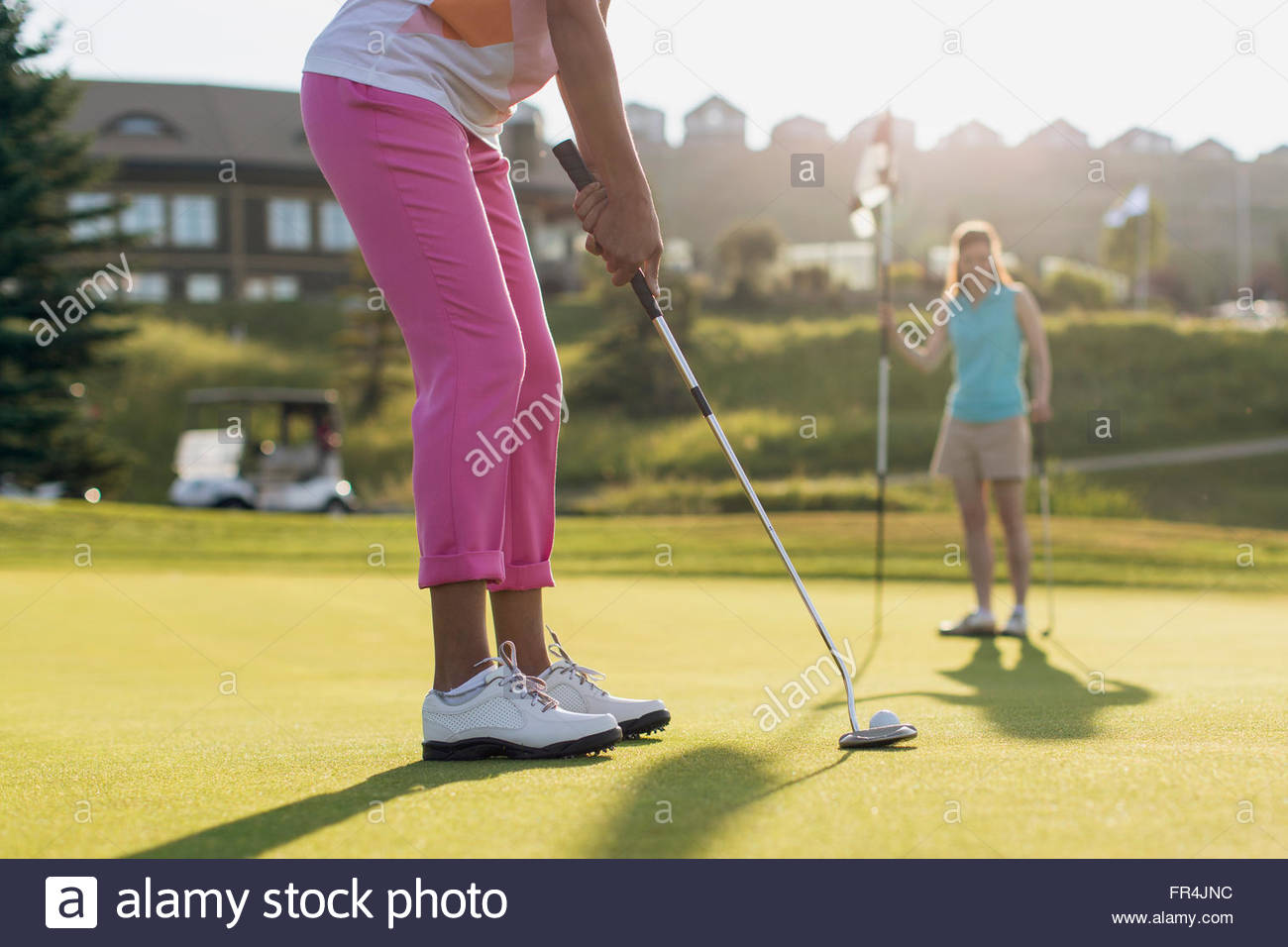 Golf flag green putter hi-res stock photography and images - Alamy