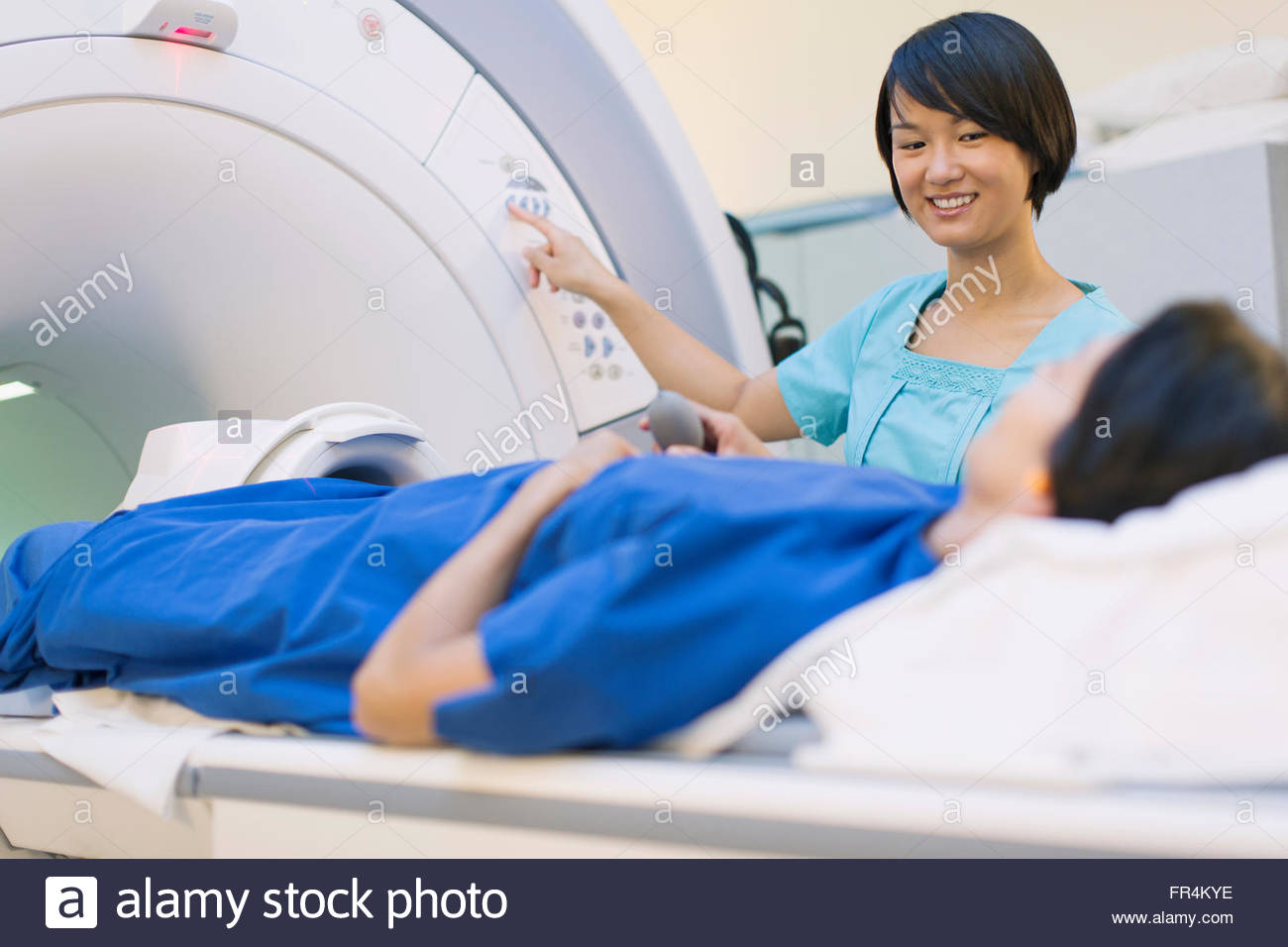technician walking with patient about to have MRI scan Stock Photo - Alamy