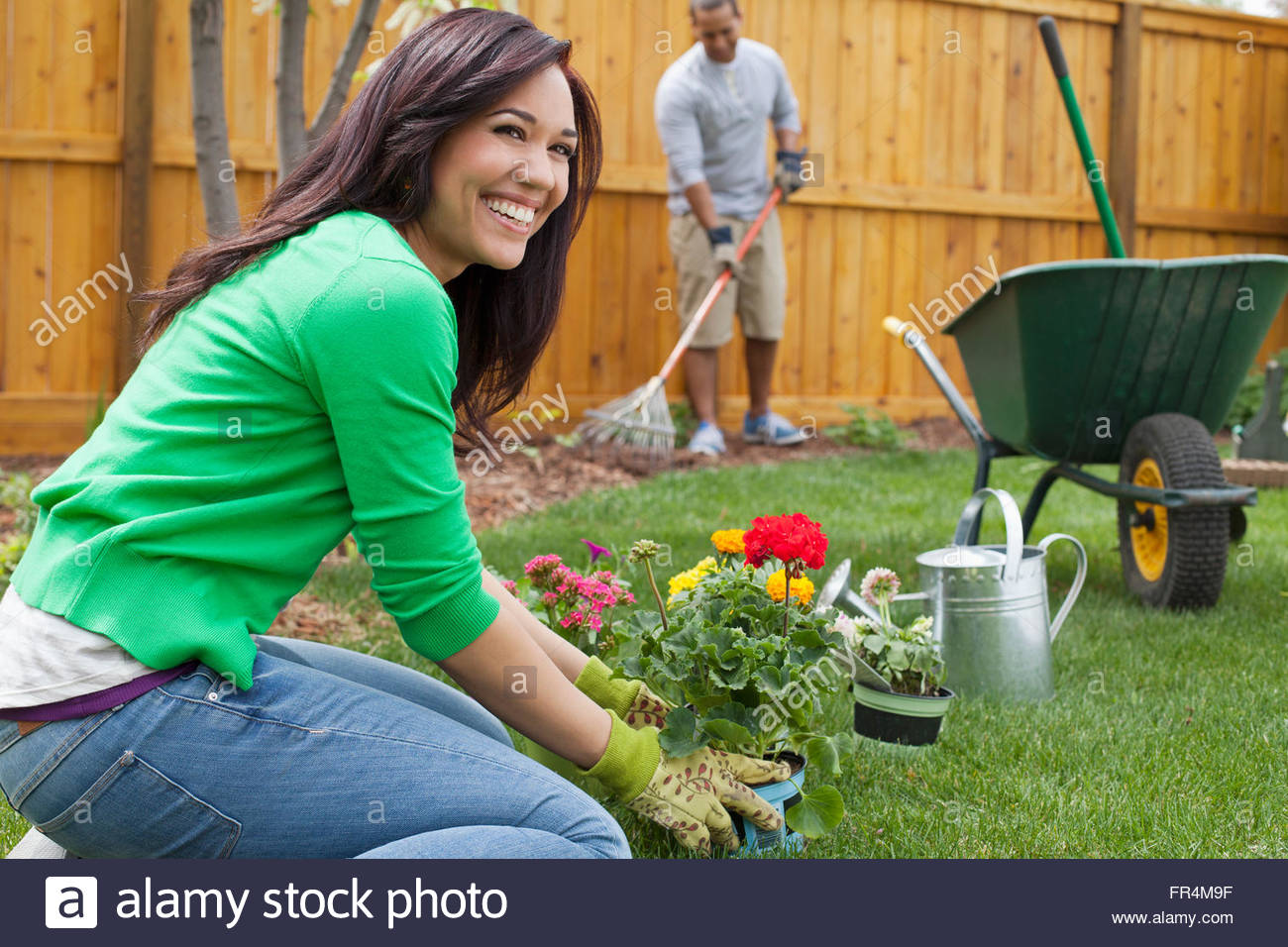 couple working in backyard together Stock Photo - Alamy