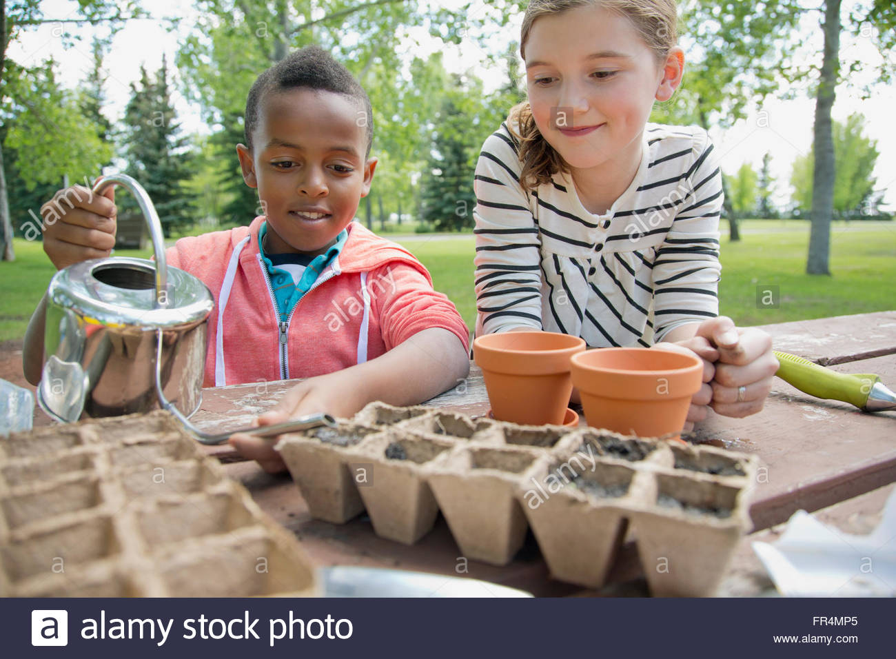 Students planting seeds hi-res stock photography and images - Alamy