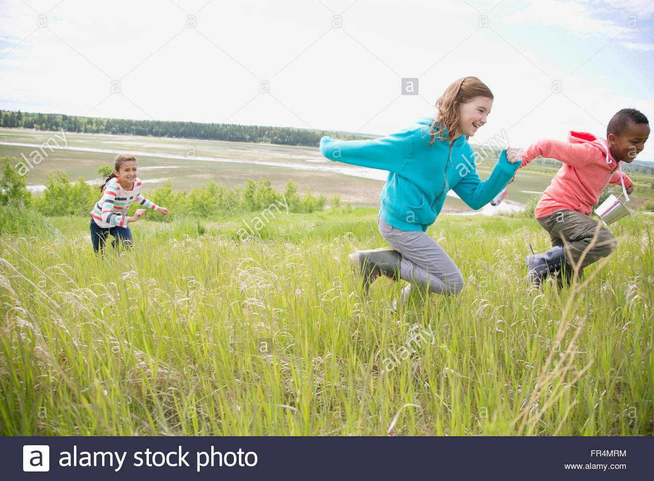Children chasing running hi-res stock photography and images - Alamy