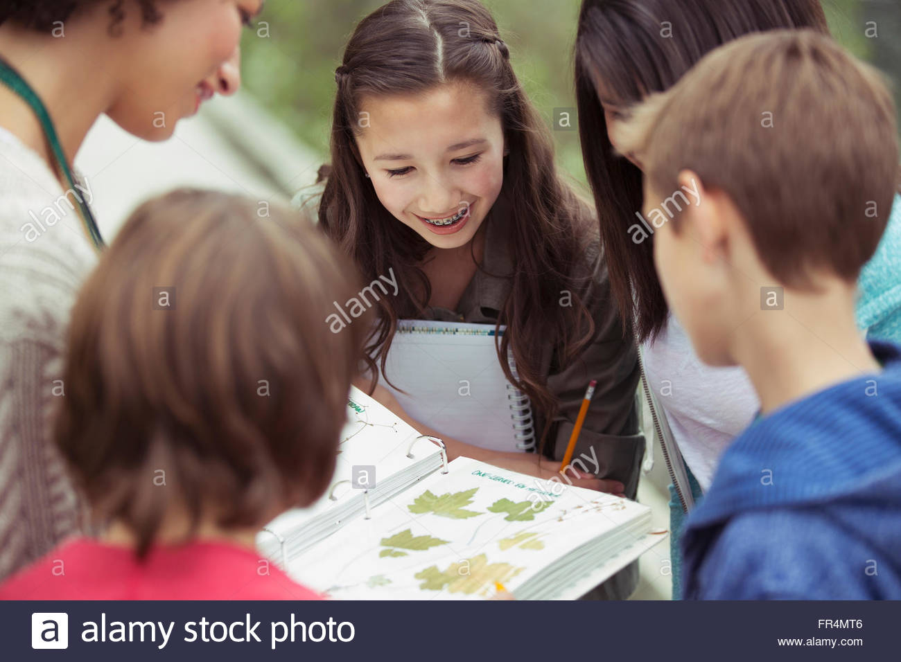 students and teacher identifying plants Stock Photo - Alamy