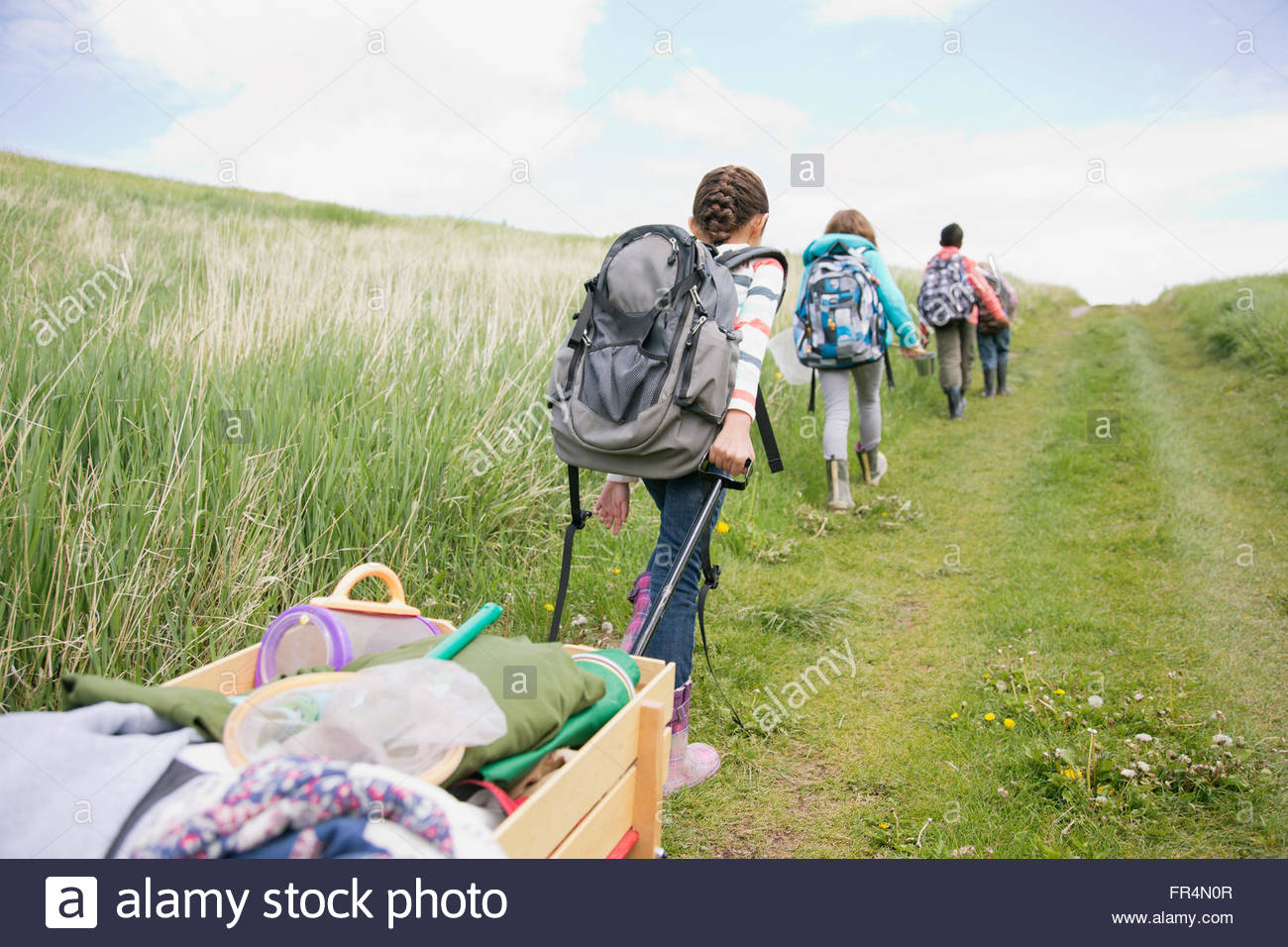 Child pulling backpack school hi-res stock photography and images - Alamy
