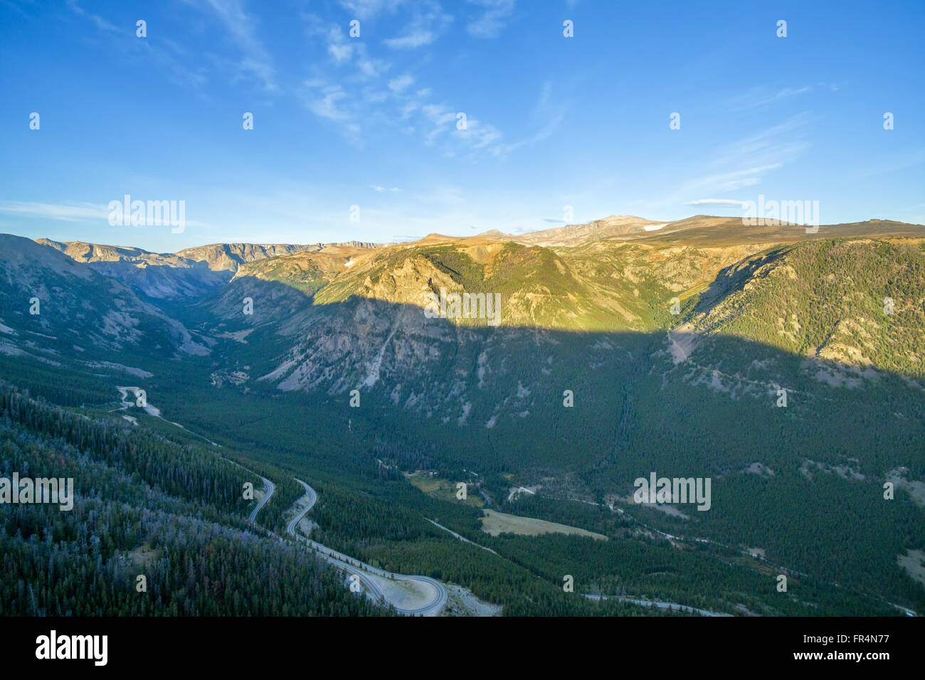 Aerial view of the Beartooth Mountains with a switchback road visible ...