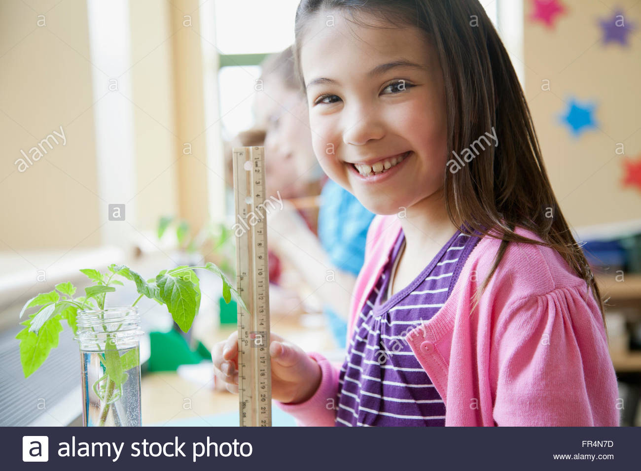 Elementary student measuring plant hi-res stock photography and images ...