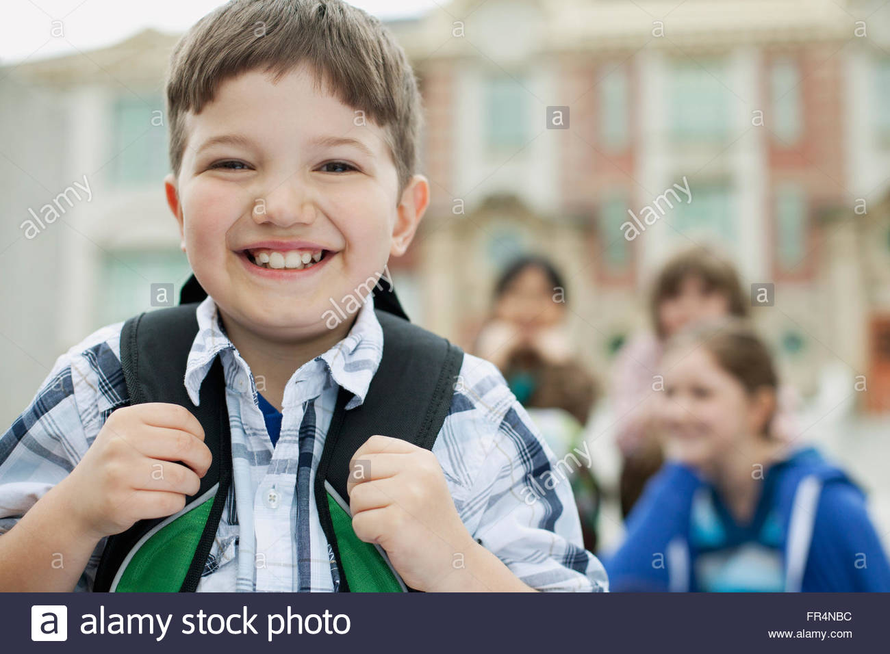 Portrait of male, elementary student going back to school Stock Photo ...