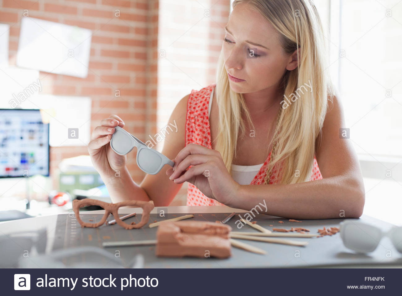 pretty, industrial designer working on prototype Stock Photo - Alamy