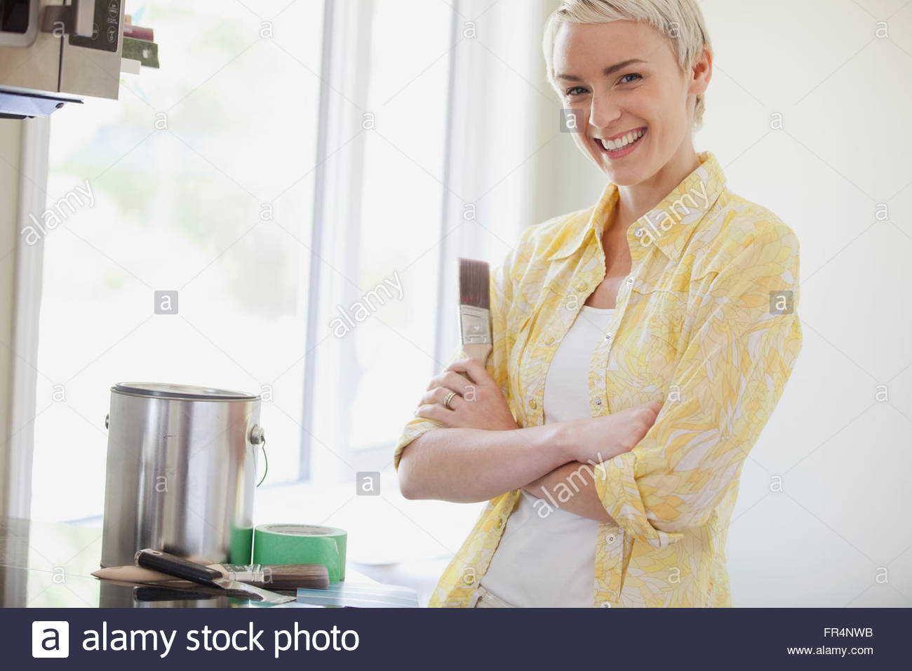 pretty, mid adult woman prepping to paint Stock Photo - Alamy