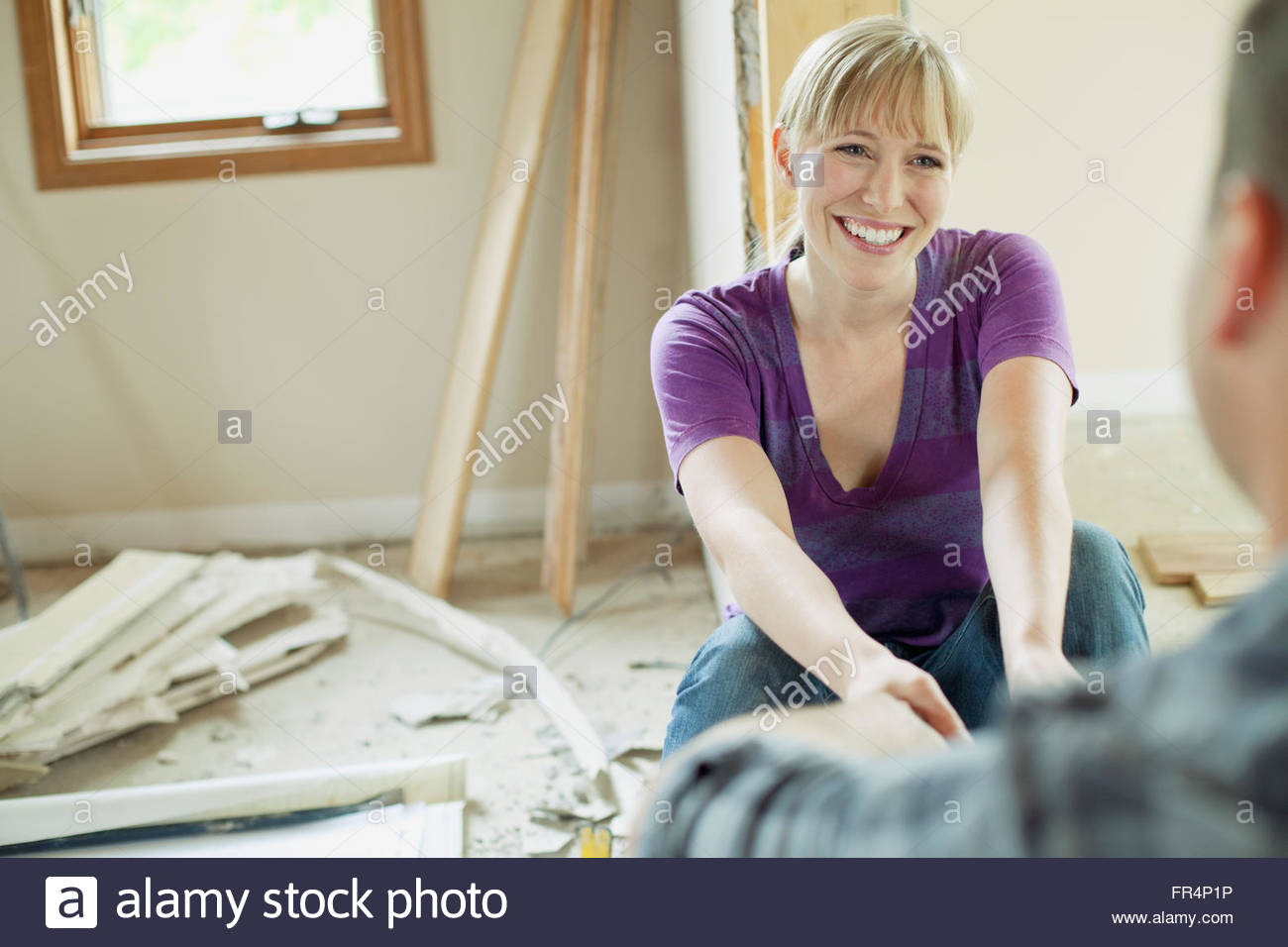 mid adult couple taking a break from renovations Stock Photo - Alamy