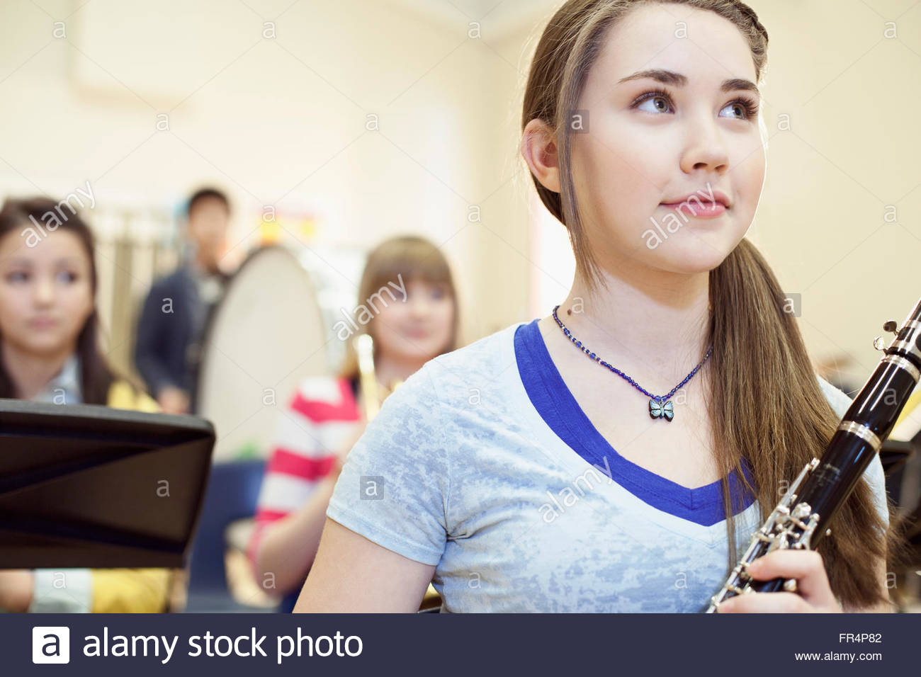 portrait of pretty band member holding clarinet Stock Photo - Alamy