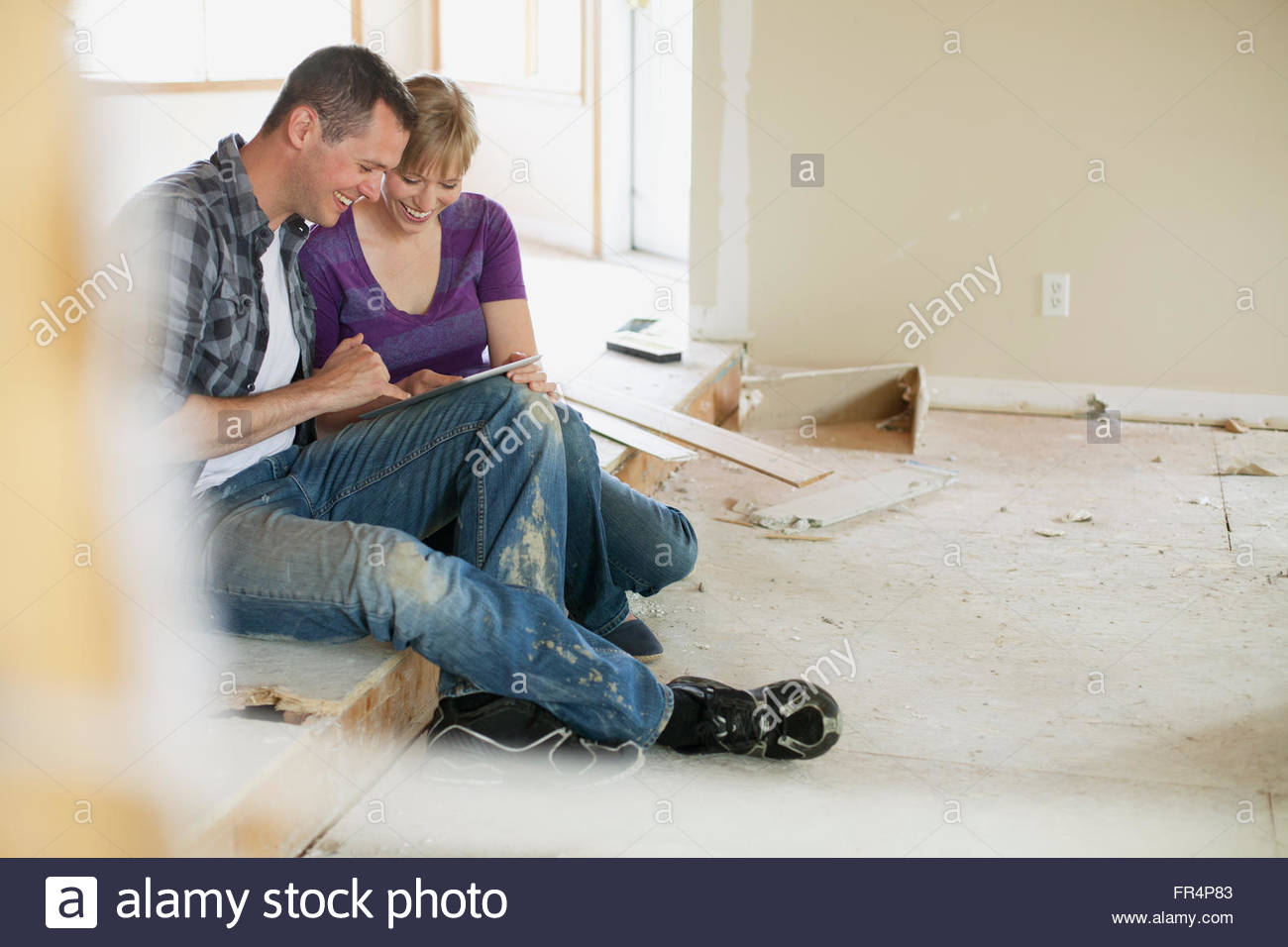 mid adult couple making renovation choices Stock Photo - Alamy