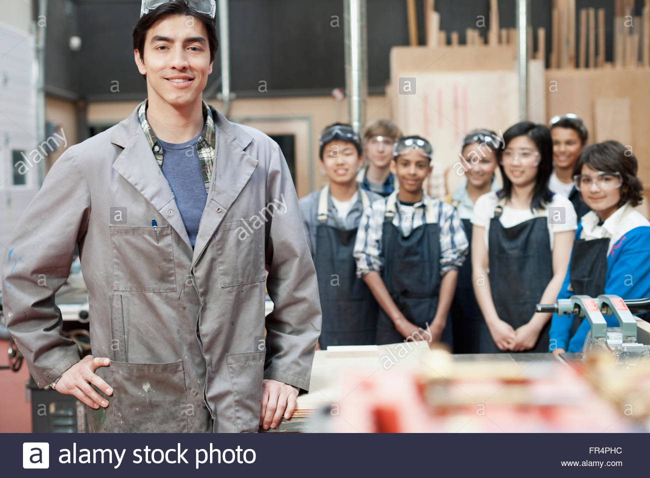 portrait of teacher with students in shop class Stock Photo - Alamy