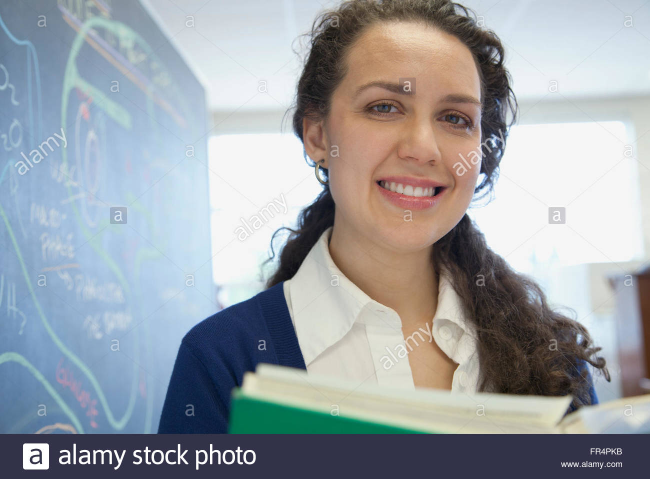 portrait of pretty, middle school teacher Stock Photo - Alamy