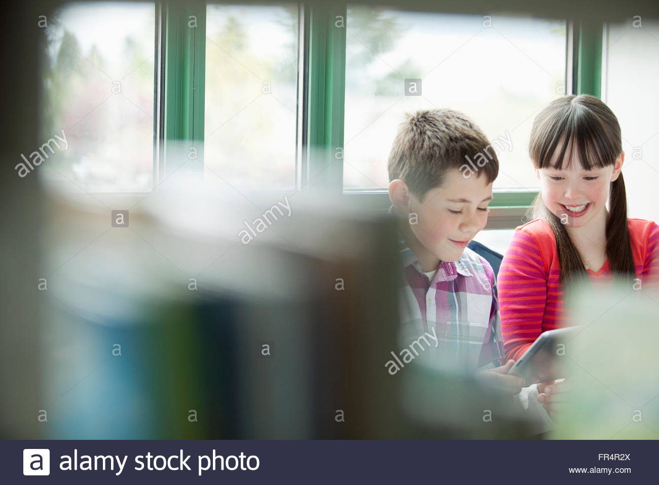 elementary students with pc tablet Stock Photo - Alamy