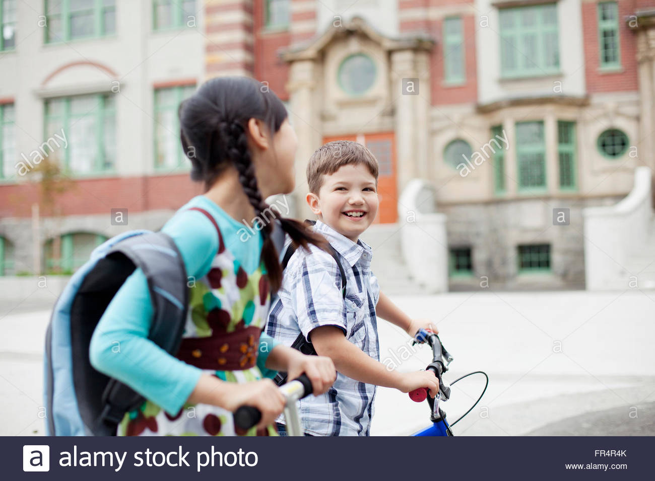 elementary students riding to school Stock Photo - Alamy