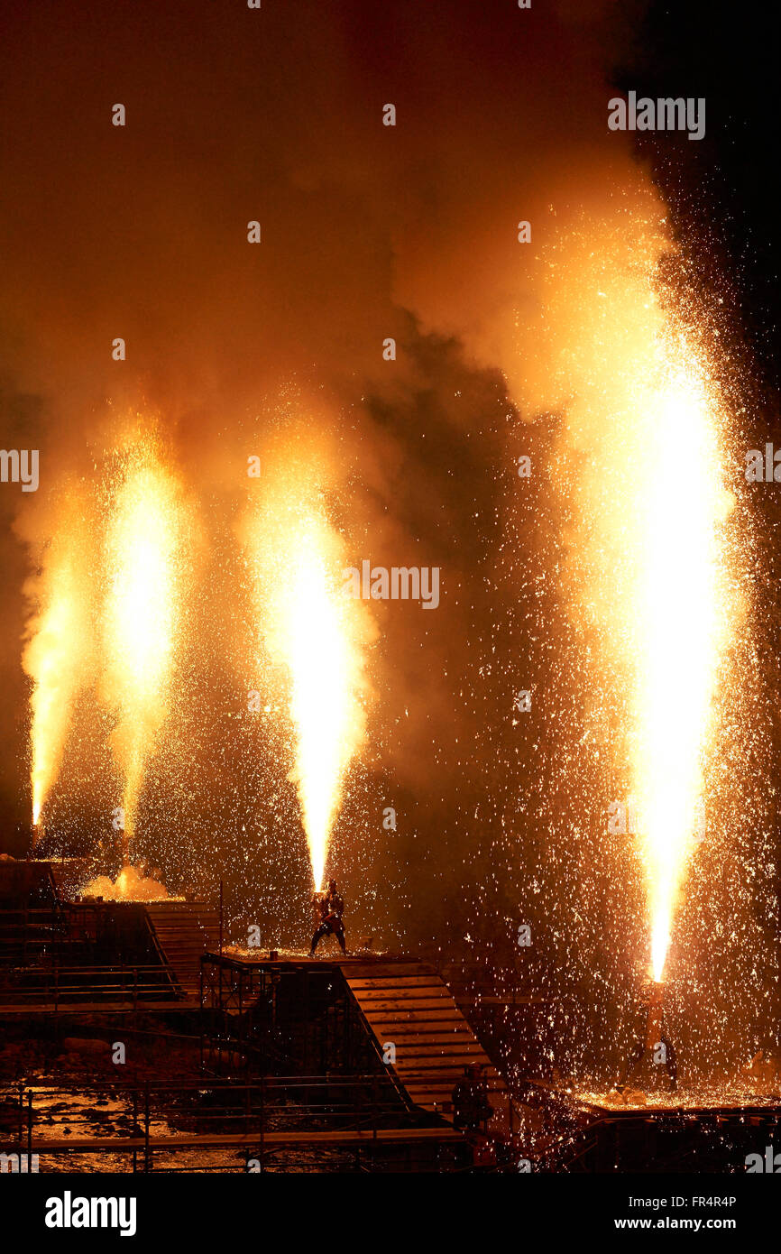 Traditional Japanese fireworks deployed from handheld bamboo cylinders ...