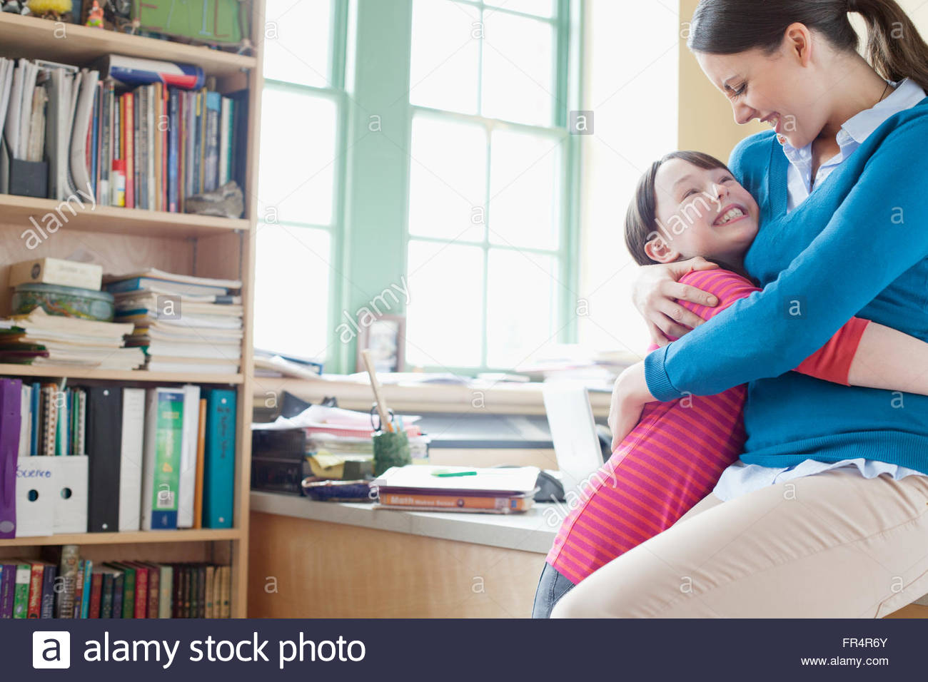 Teacher hugging student hi-res stock photography and images - Alamy