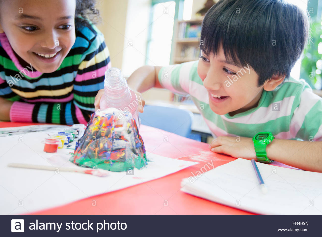 classmates creating a volcano project Stock Photo - Alamy