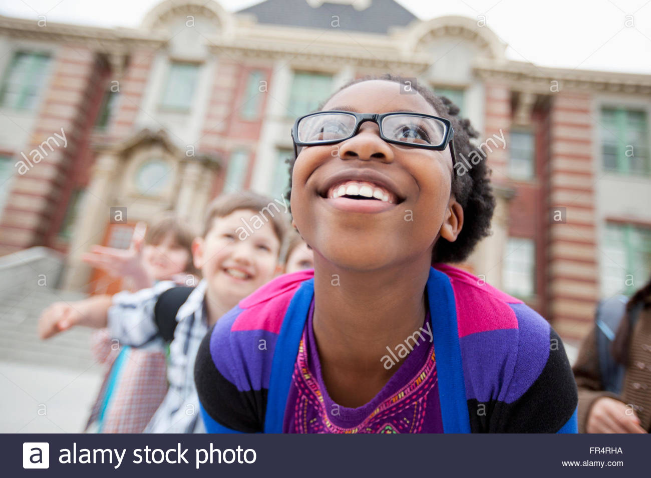 elementary students having fun outside Stock Photo - Alamy
