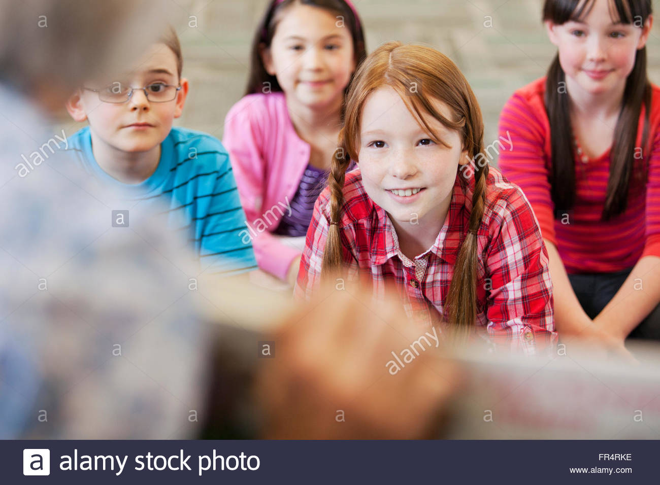 Senior woman reading child class hi-res stock photography and images - Alamy
