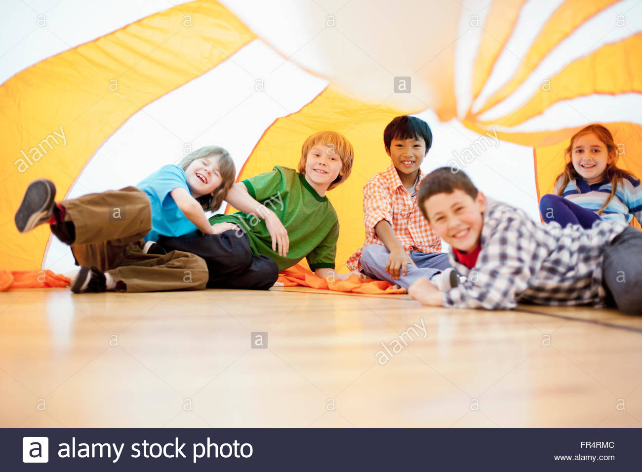 elementary students playing in gymnasium Stock Photo - Alamy
