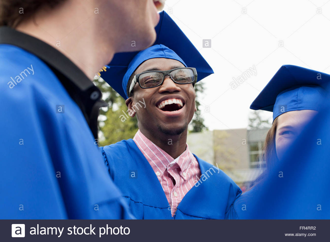Happy graduates blue hi-res stock photography and images - Alamy