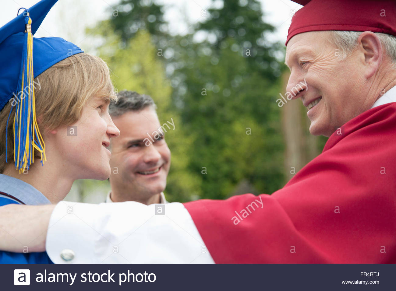 male graduate with university dean Stock Photo - Alamy