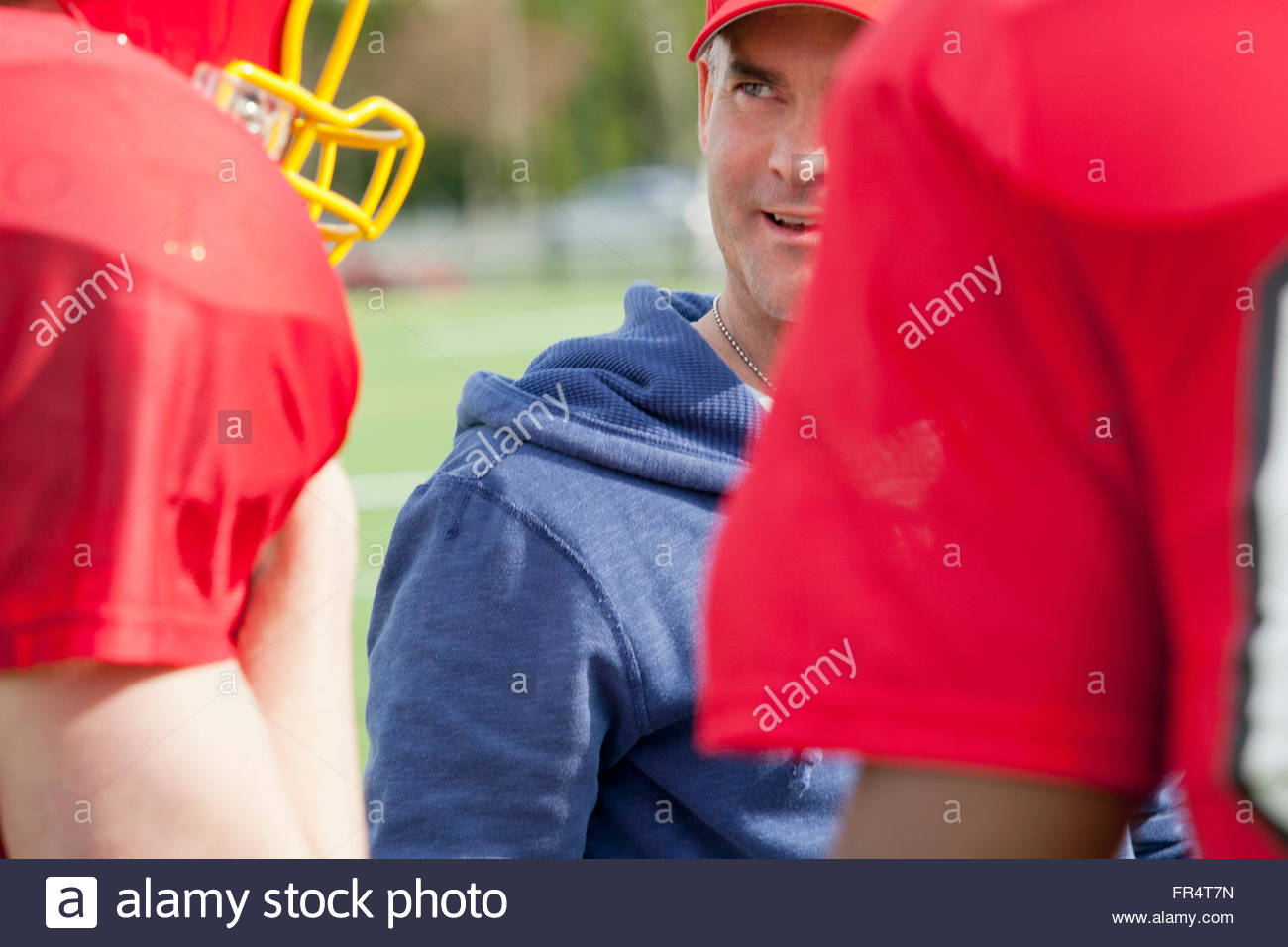 Coach talking to football players hi-res stock photography and images ...