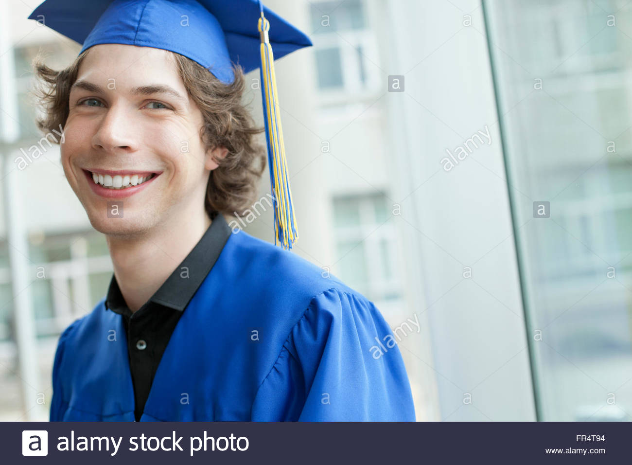 Young man in graduation robe hi-res stock photography and images - Alamy