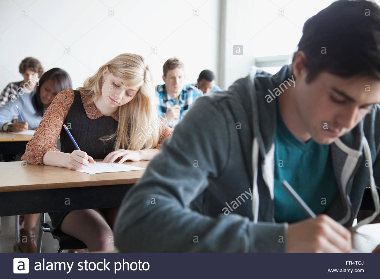college students writing an exam Stock Photo - Alamy