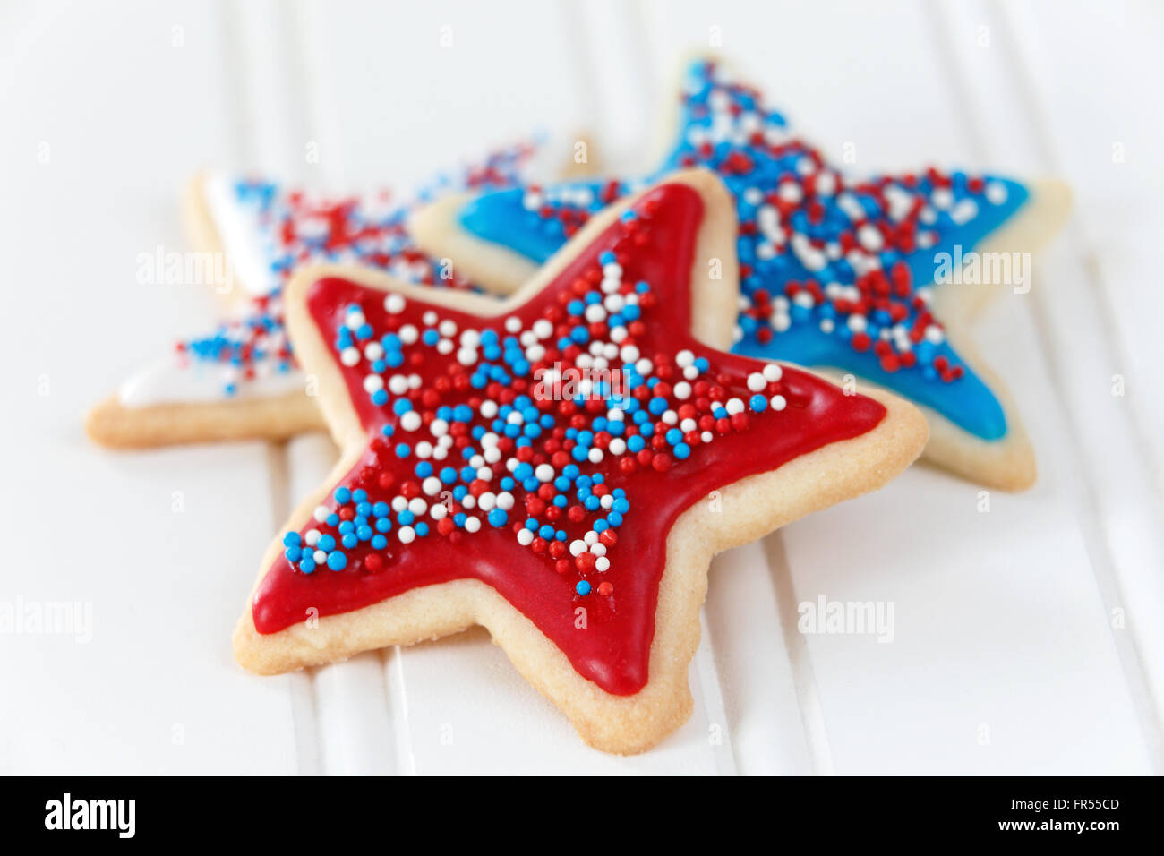 Sugar Cookies With Red Blue And White Icing And Sprinkles Decorated